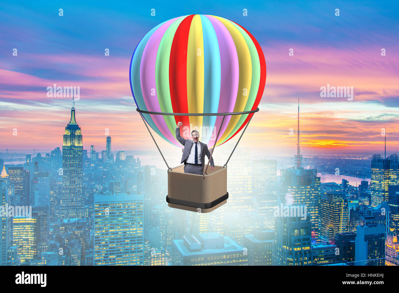 Businessman flying on balloon in challenge concept Stock Photo - Alamy