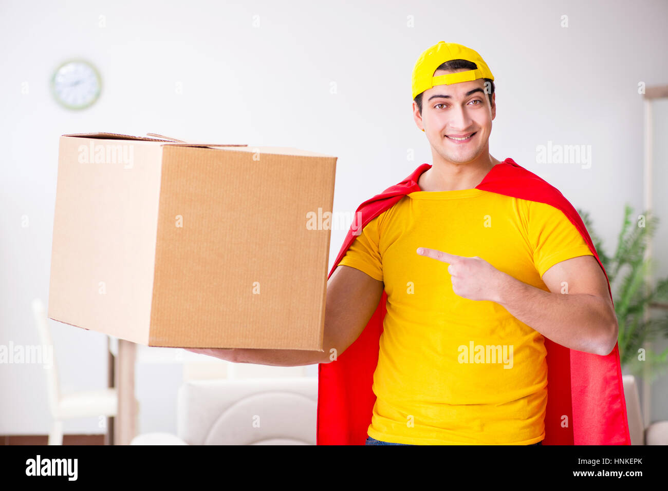 Superhero delivery guy with box Stock Photo - Alamy