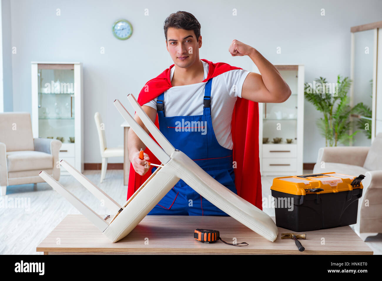 Super hero repairman working at home Stock Photo - Alamy
