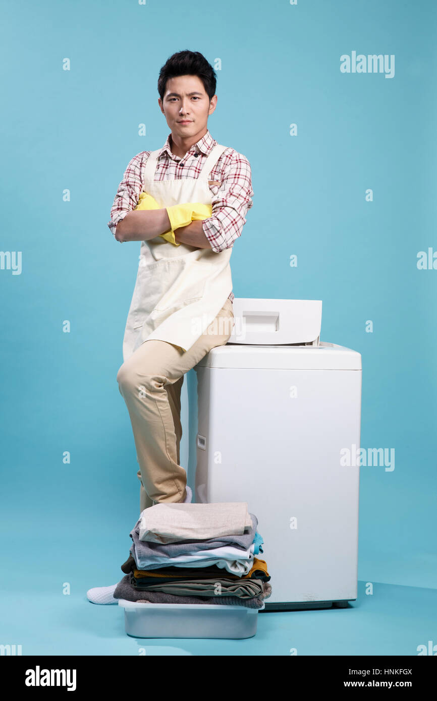 Young men do housework Stock Photo - Alamy