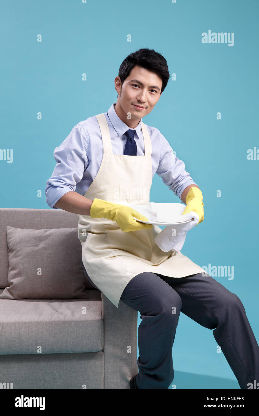 Young men do housework Stock Photo - Alamy