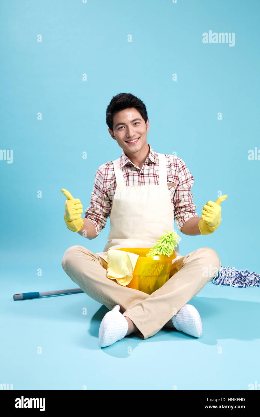 Young men do housework Stock Photo - Alamy