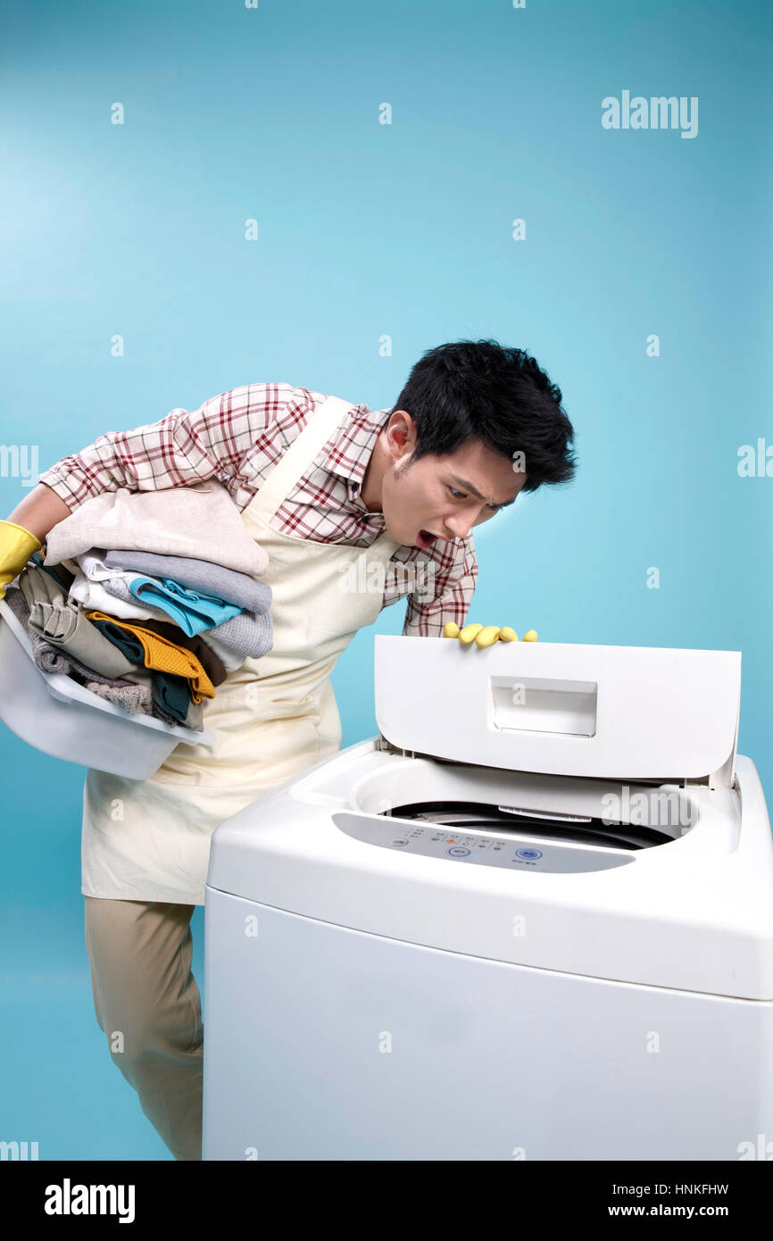 Young men do housework Stock Photo - Alamy