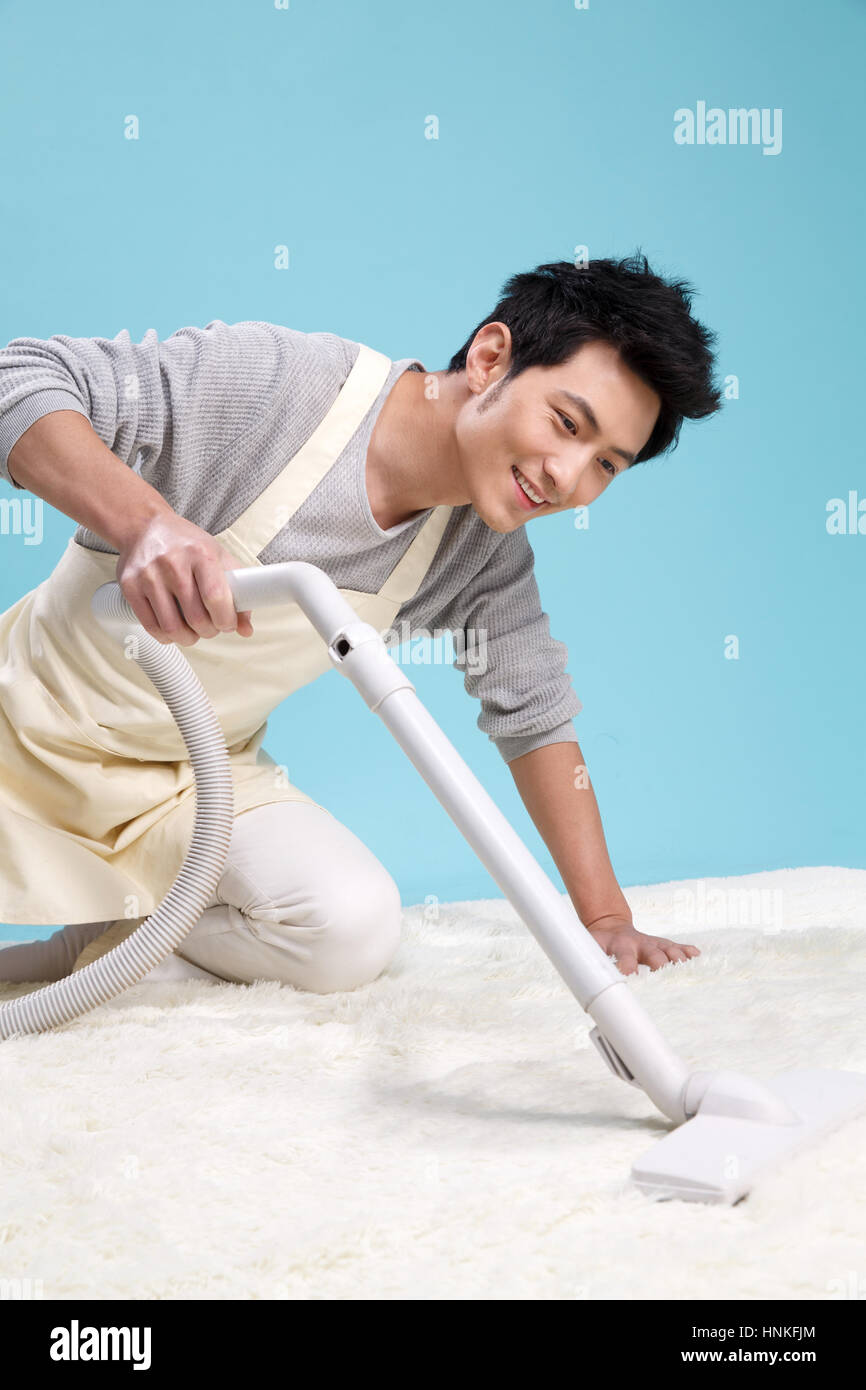 Young men do housework Stock Photo - Alamy