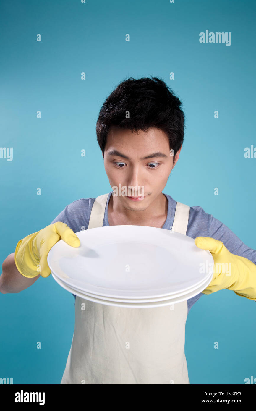 Young men do housework Stock Photo - Alamy