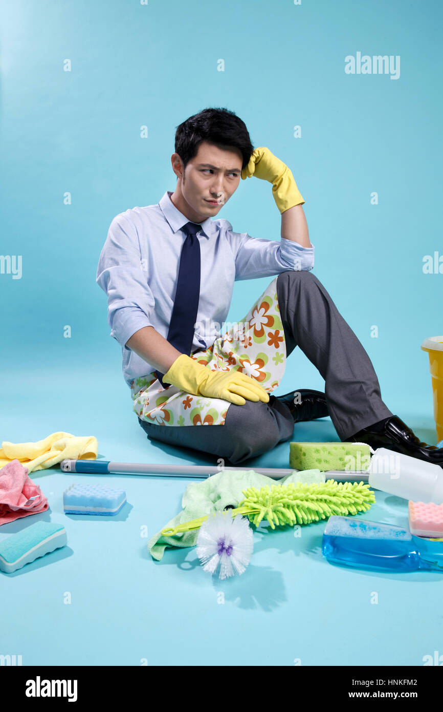 Young men do housework Stock Photo - Alamy