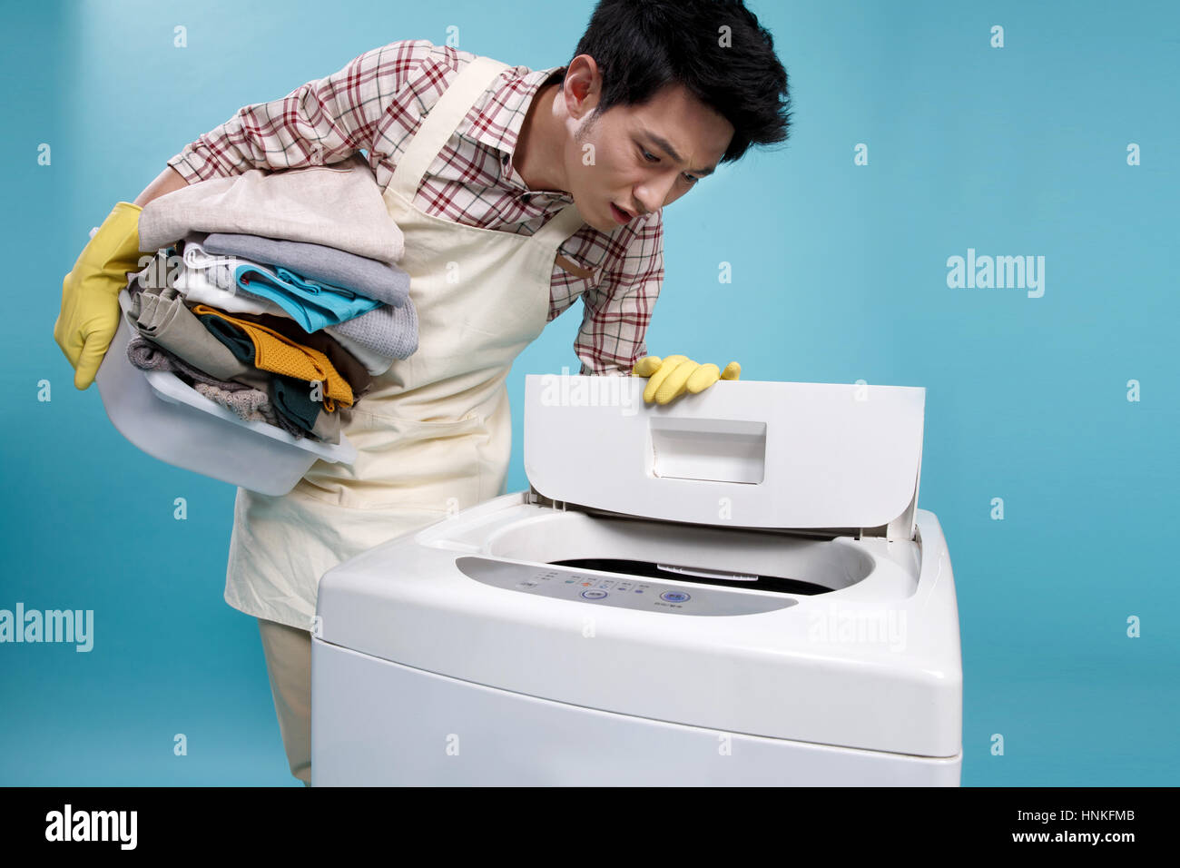 Young men do housework Stock Photo - Alamy