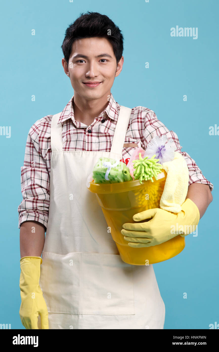 Young men do housework Stock Photo - Alamy