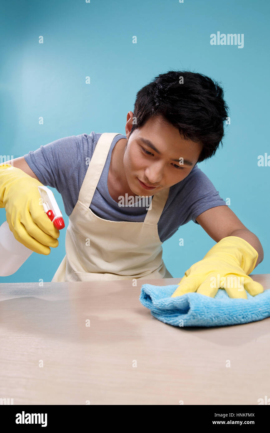 Young men do housework Stock Photo - Alamy