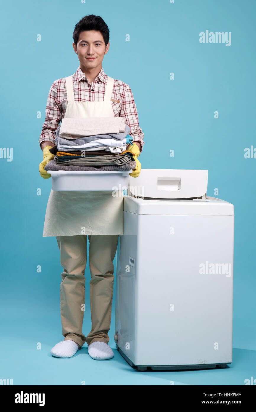 Young men do housework Stock Photo - Alamy
