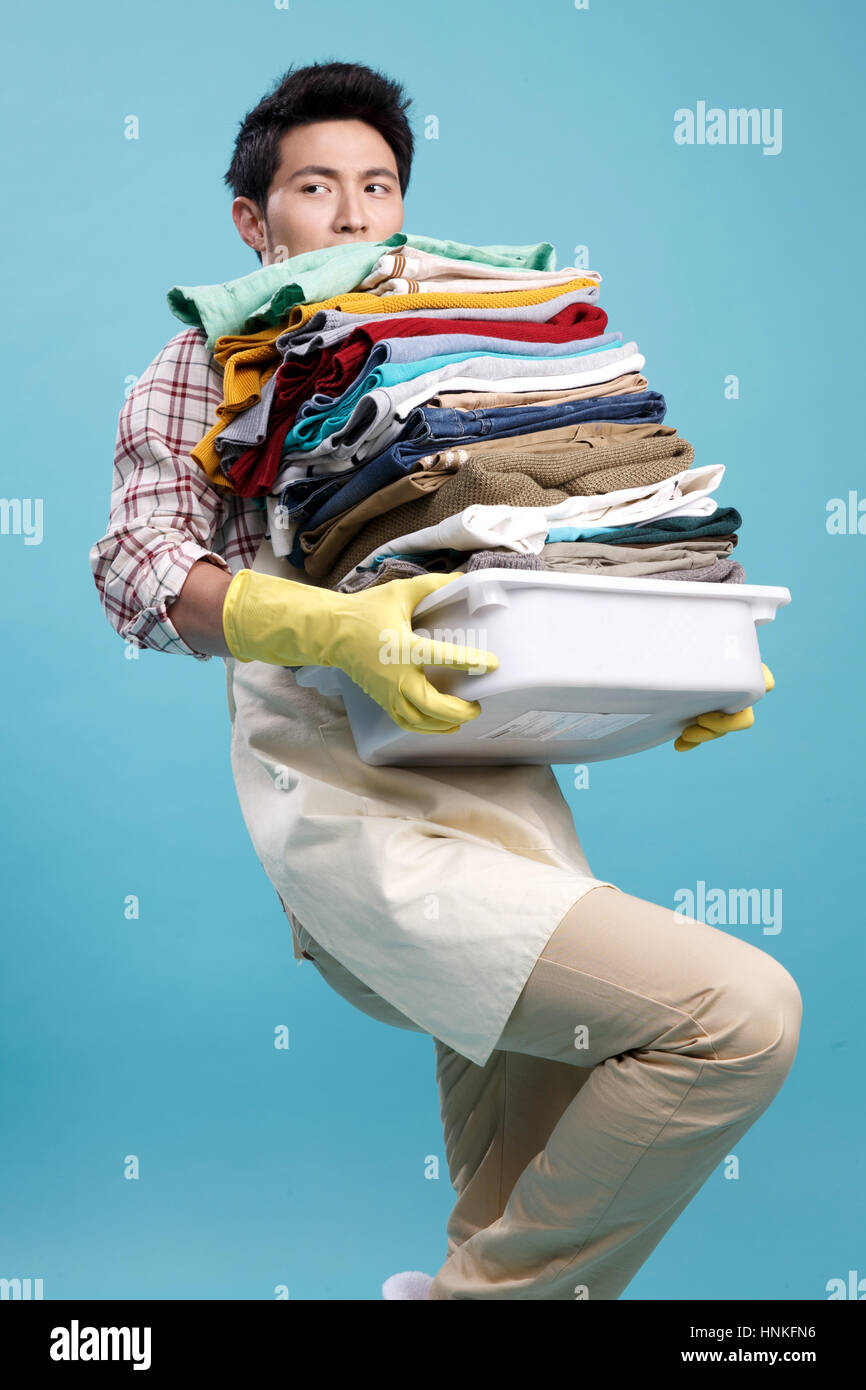 Young men do housework Stock Photo - Alamy