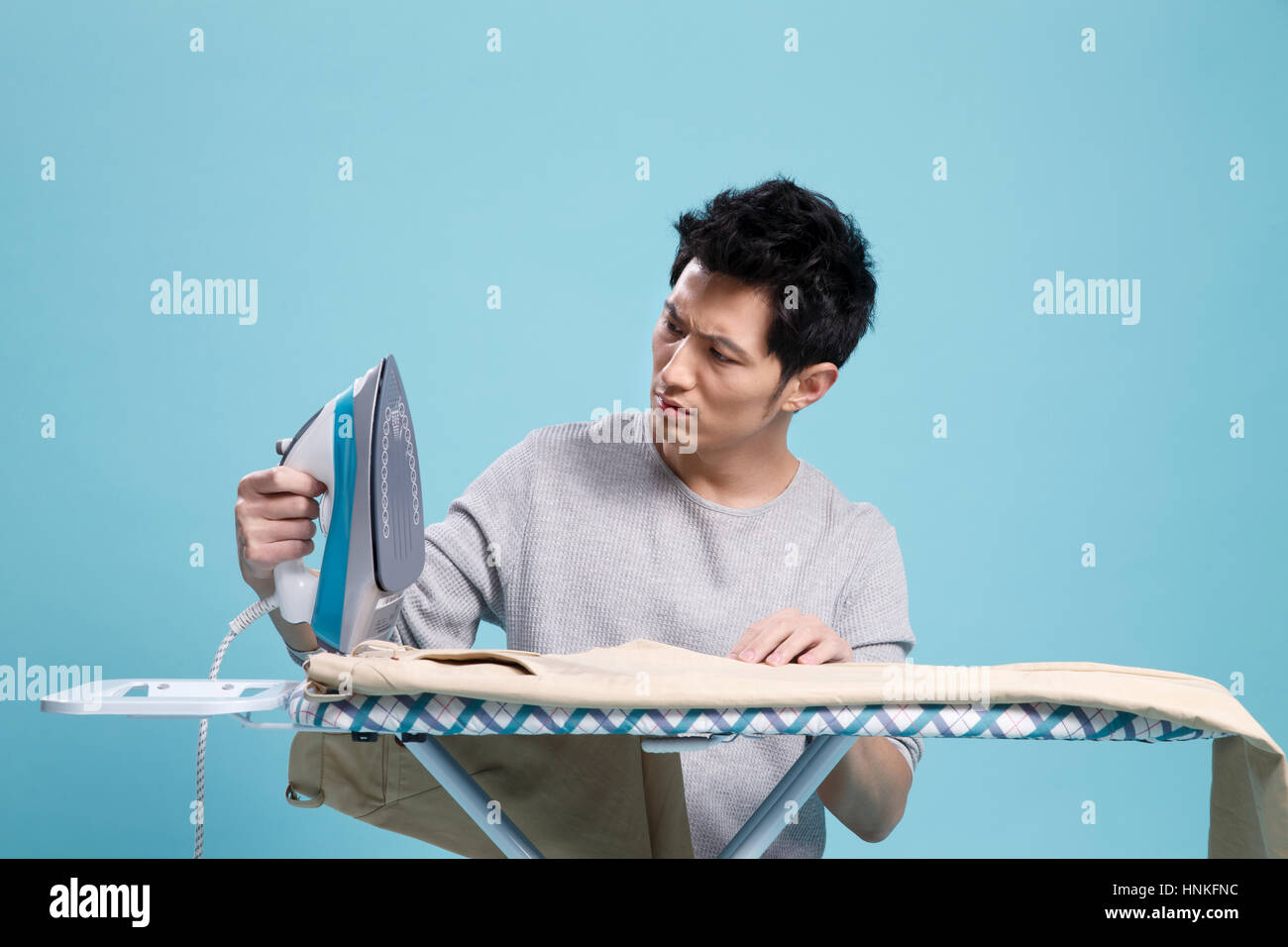 Young men do housework Stock Photo - Alamy