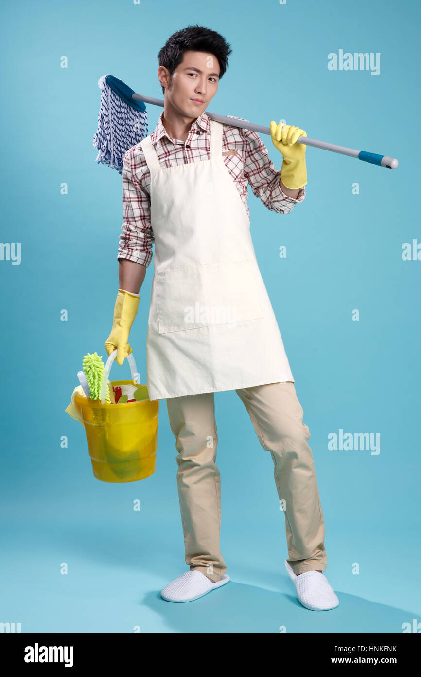 Young men do housework Stock Photo - Alamy