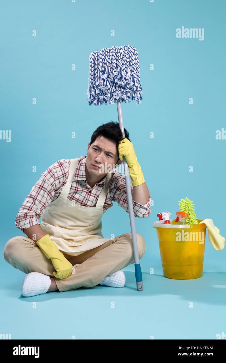 Young men do housework Stock Photo - Alamy