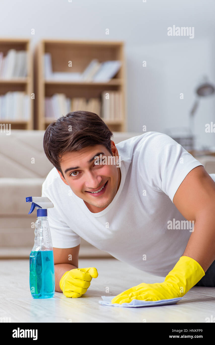 Man husband cleaning the house helping wife Stock Photo - Alamy