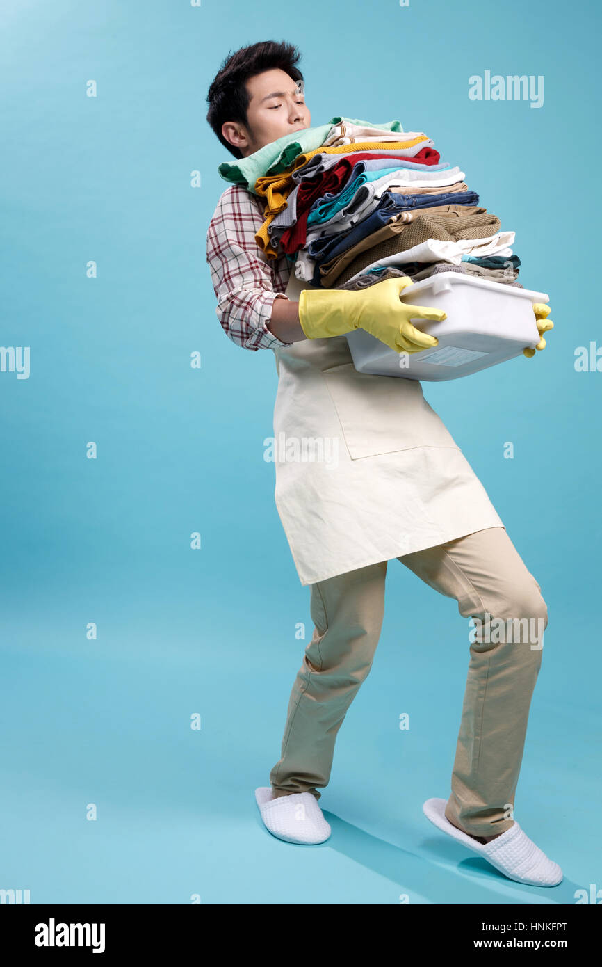 Young men do housework Stock Photo - Alamy
