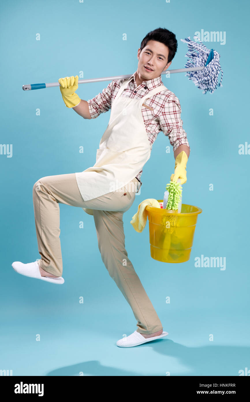 Young men do housework Stock Photo - Alamy