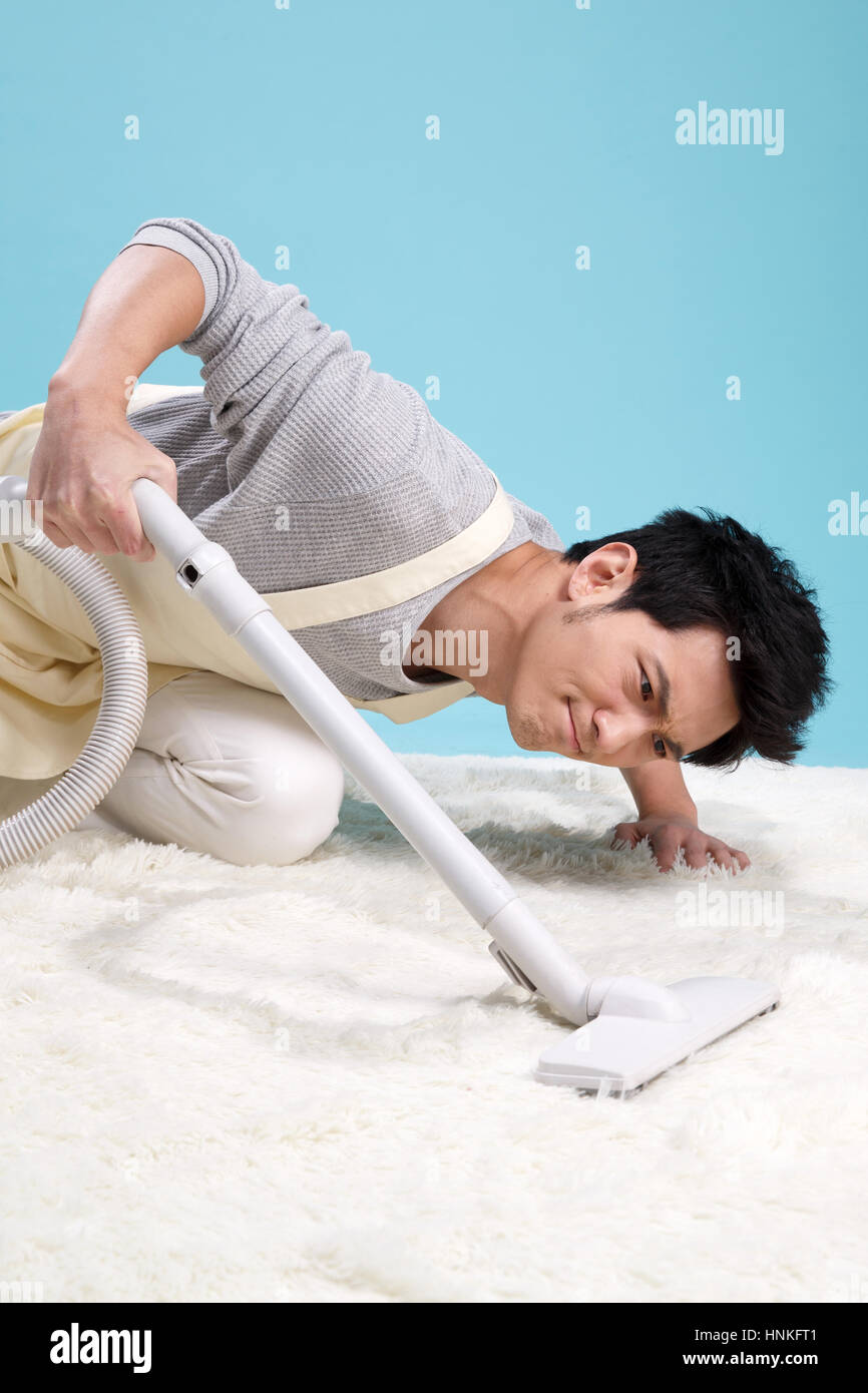Young men do housework Stock Photo - Alamy
