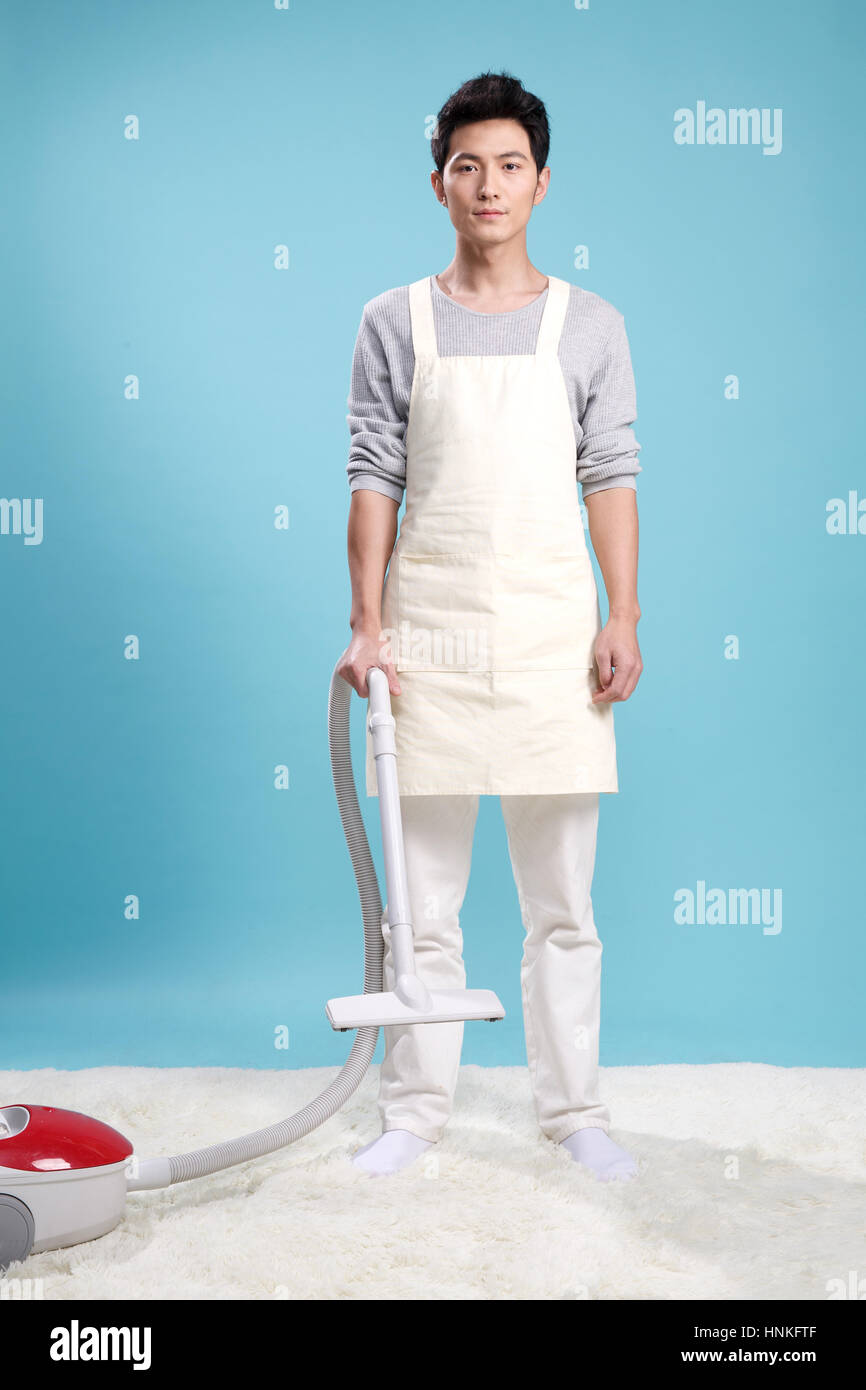Young men do housework Stock Photo - Alamy