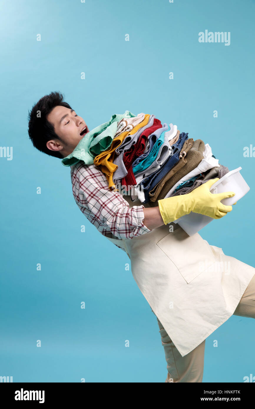 Young men do housework Stock Photo - Alamy