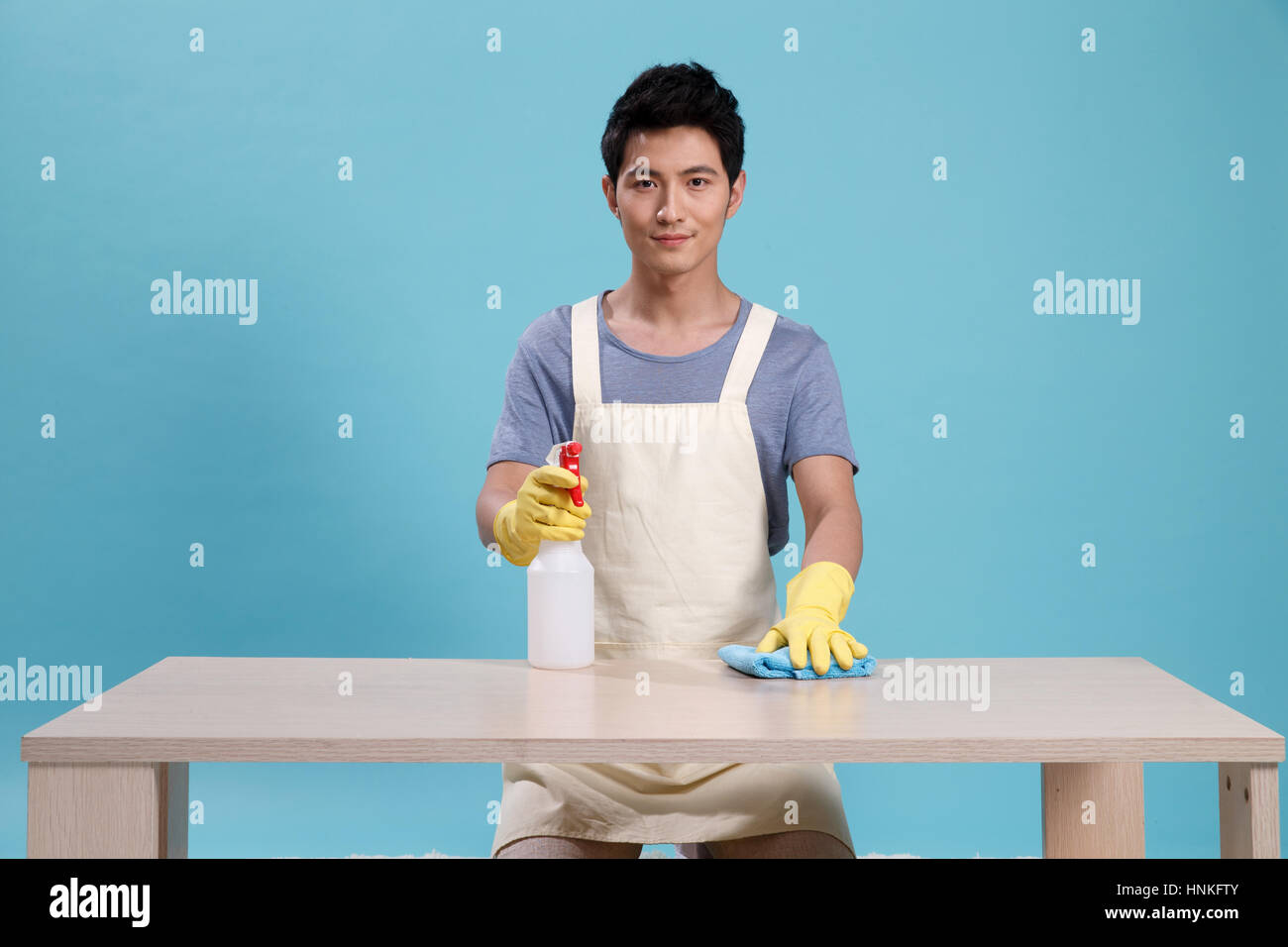 Young men do housework Stock Photo - Alamy