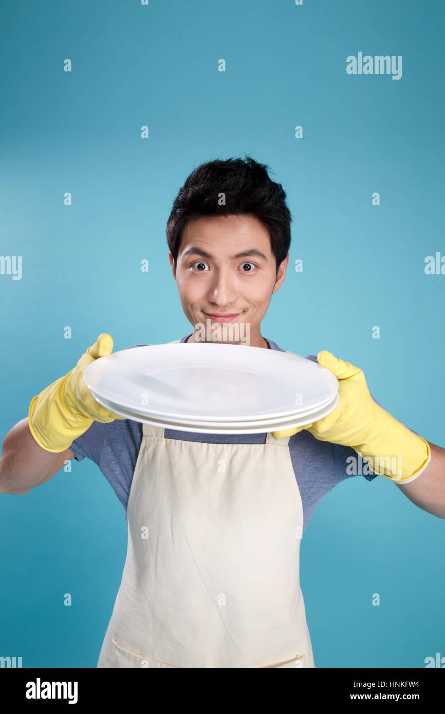 Young men do housework Stock Photo - Alamy