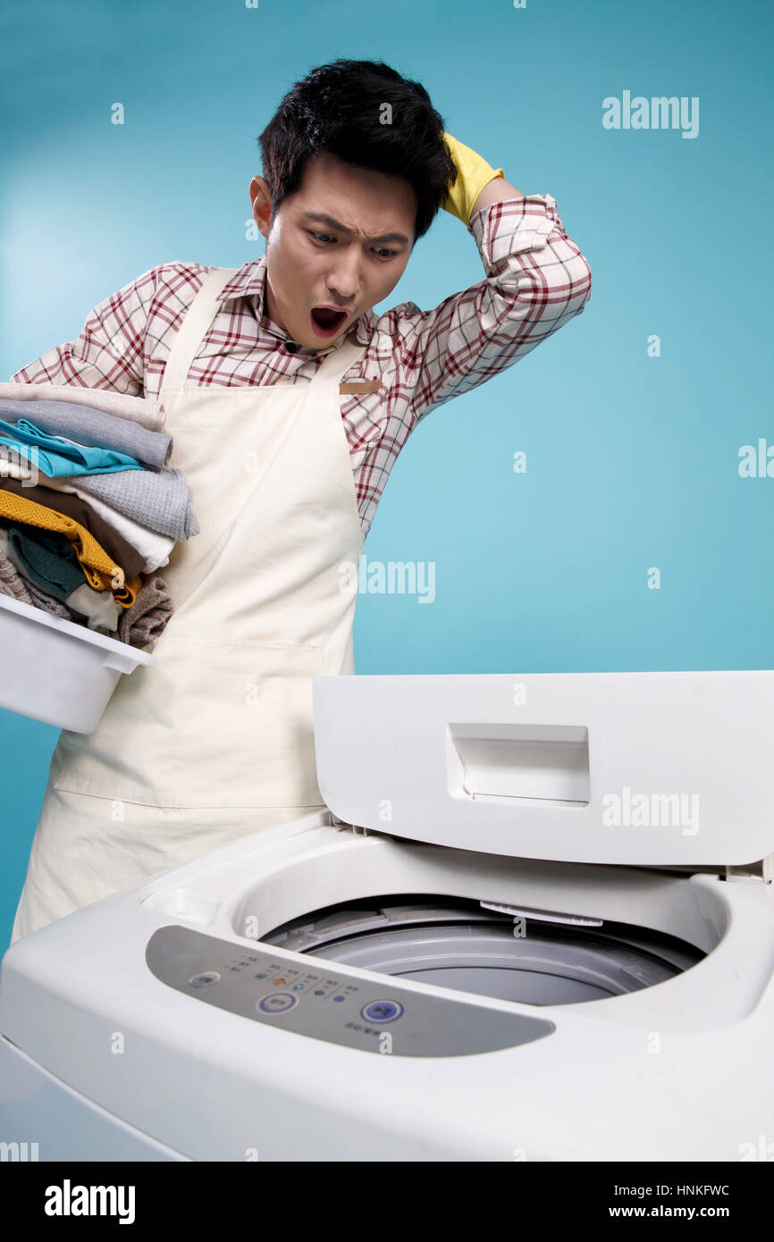 Young men do housework Stock Photo - Alamy