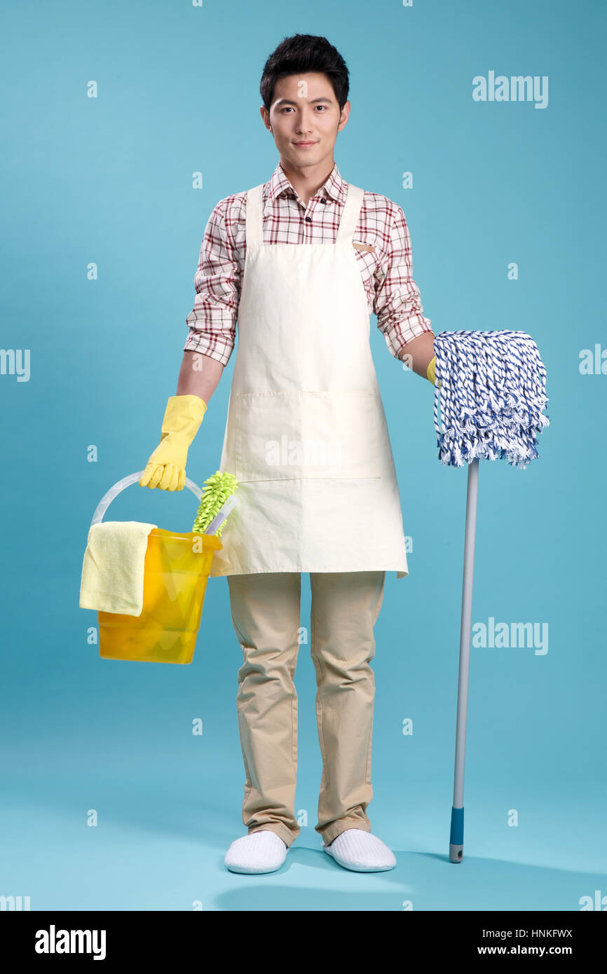 Young men do housework Stock Photo - Alamy