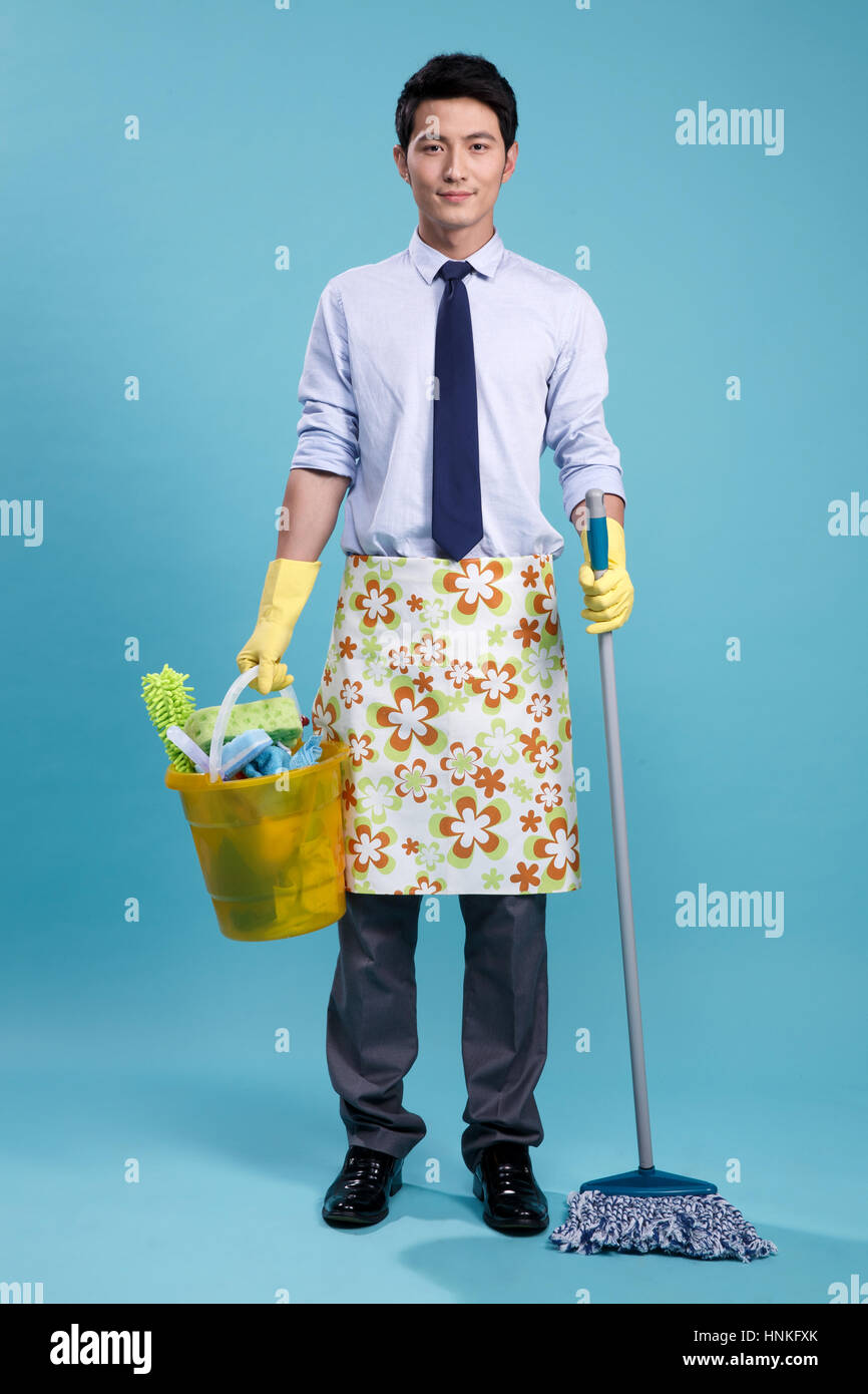 Young men do housework Stock Photo - Alamy