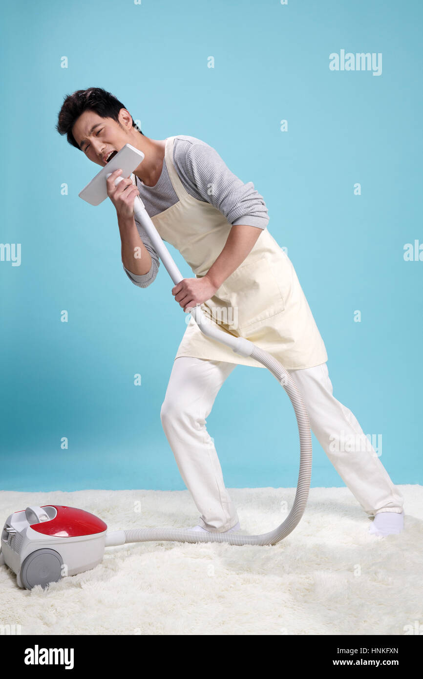Young men do housework Stock Photo - Alamy