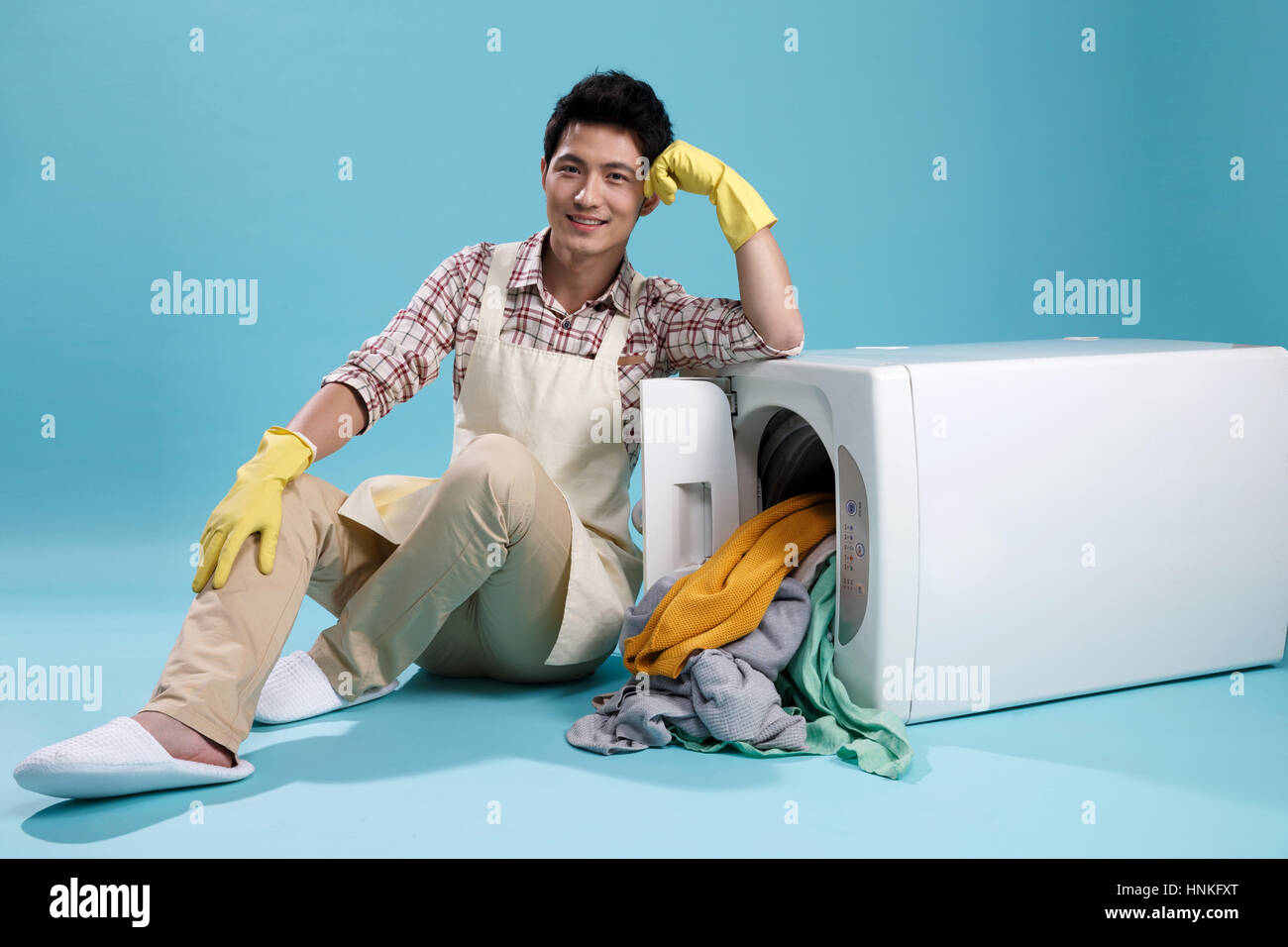 Young men do housework Stock Photo - Alamy