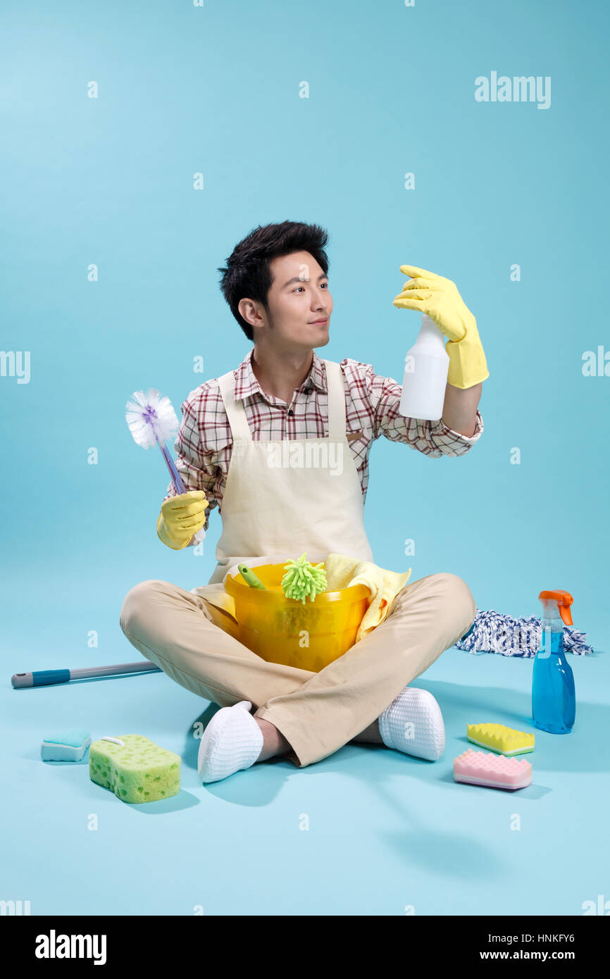 Young men do housework Stock Photo - Alamy