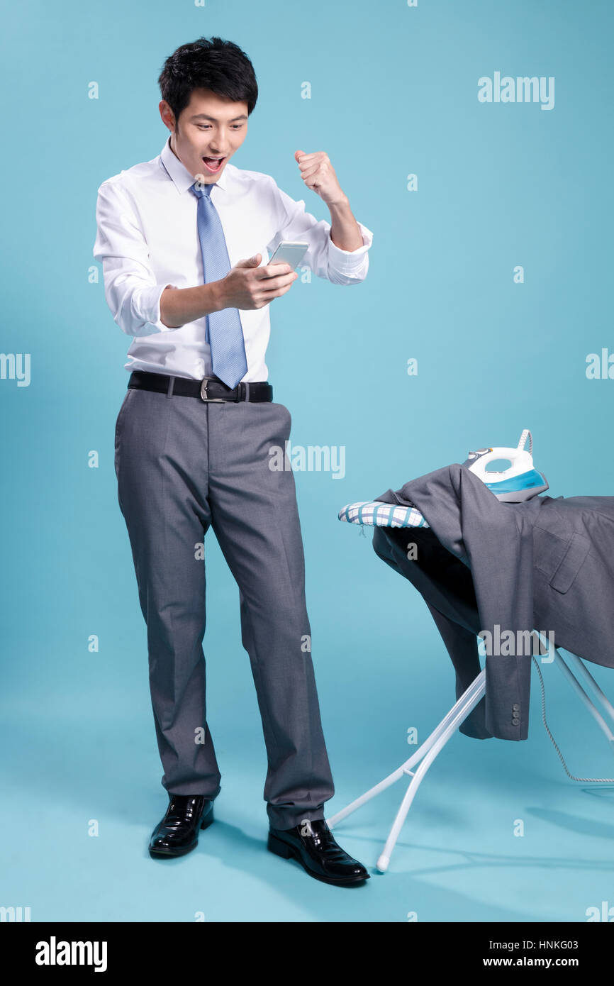 Young men do housework Stock Photo - Alamy