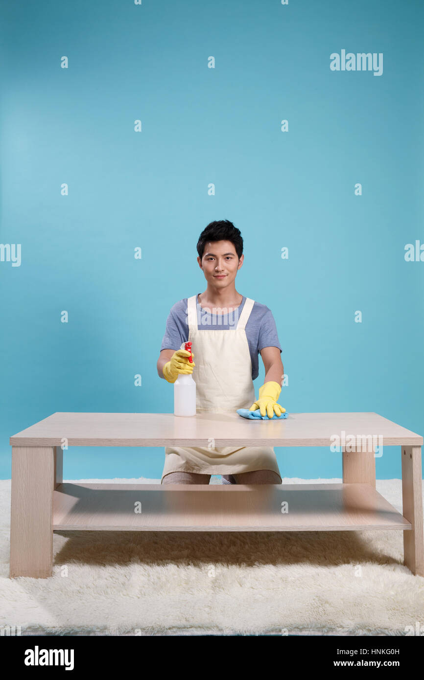 Young men do housework Stock Photo - Alamy