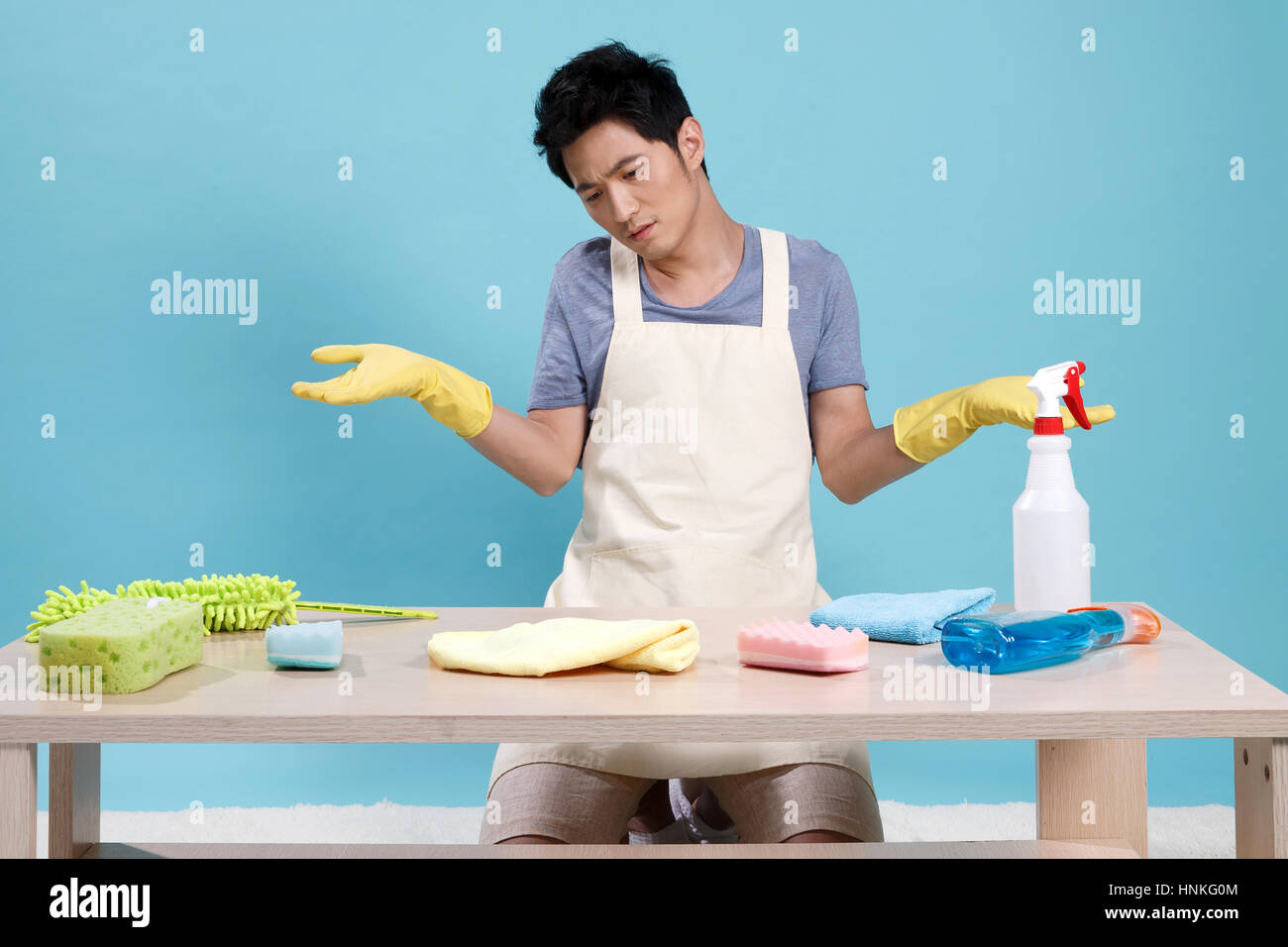 Young men do housework Stock Photo - Alamy