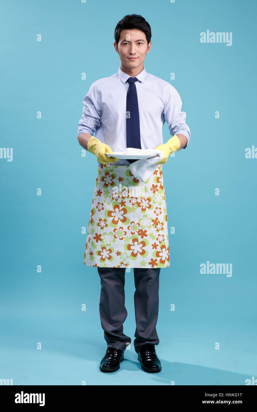 Young men do housework Stock Photo - Alamy