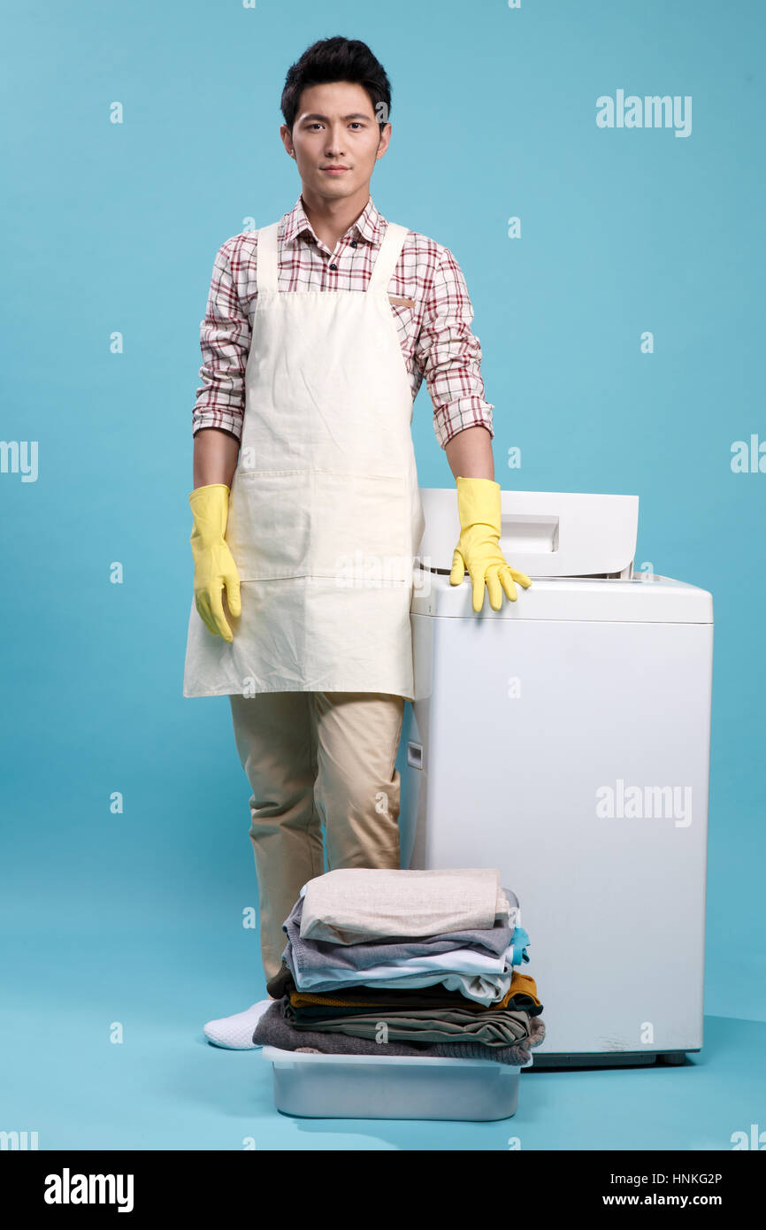 Young men do housework Stock Photo - Alamy