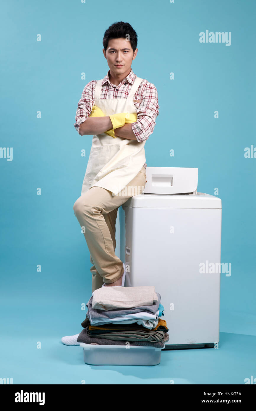 Young men do housework Stock Photo - Alamy