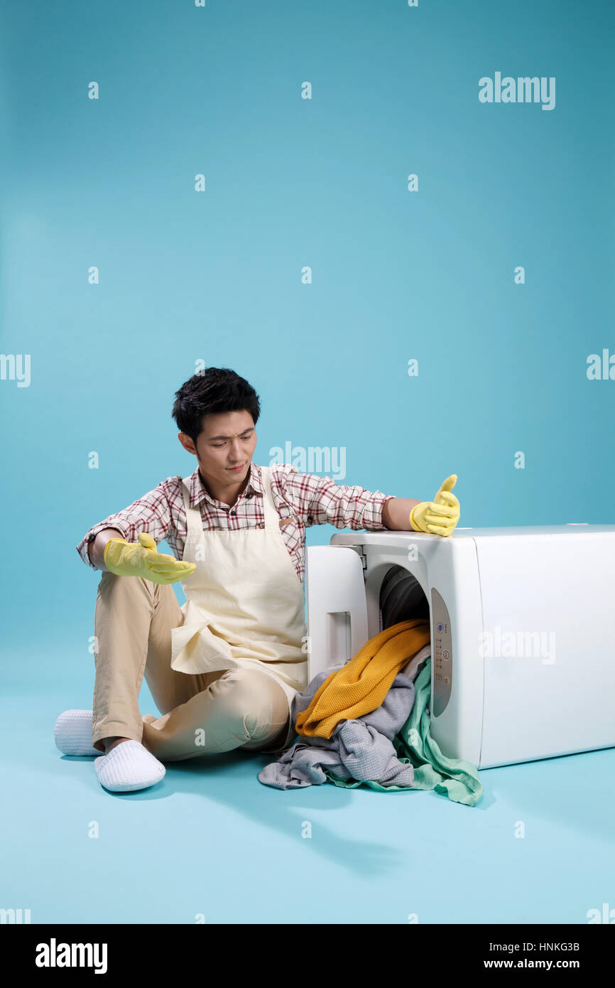 Young men do housework Stock Photo - Alamy