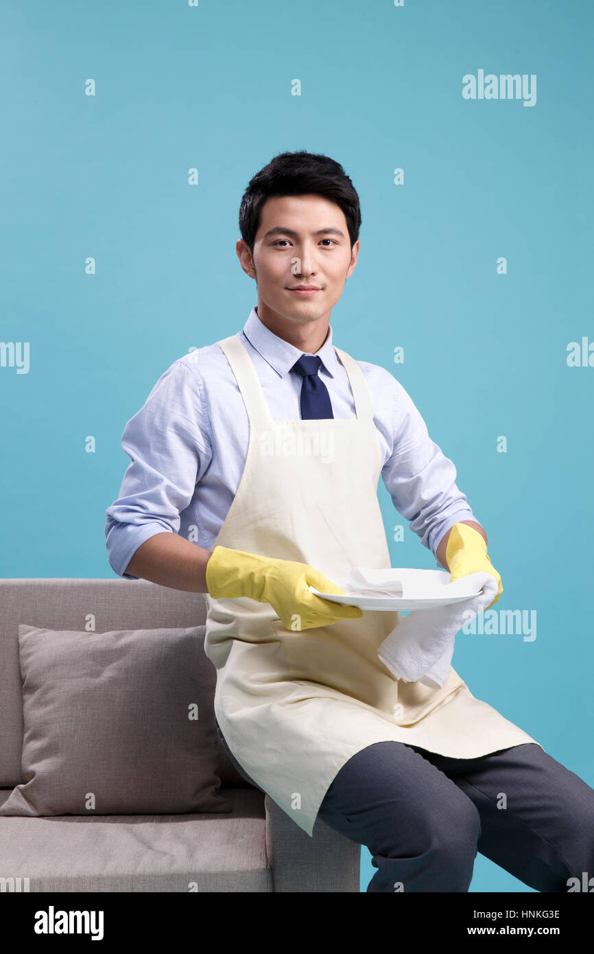 Young men do housework Stock Photo - Alamy