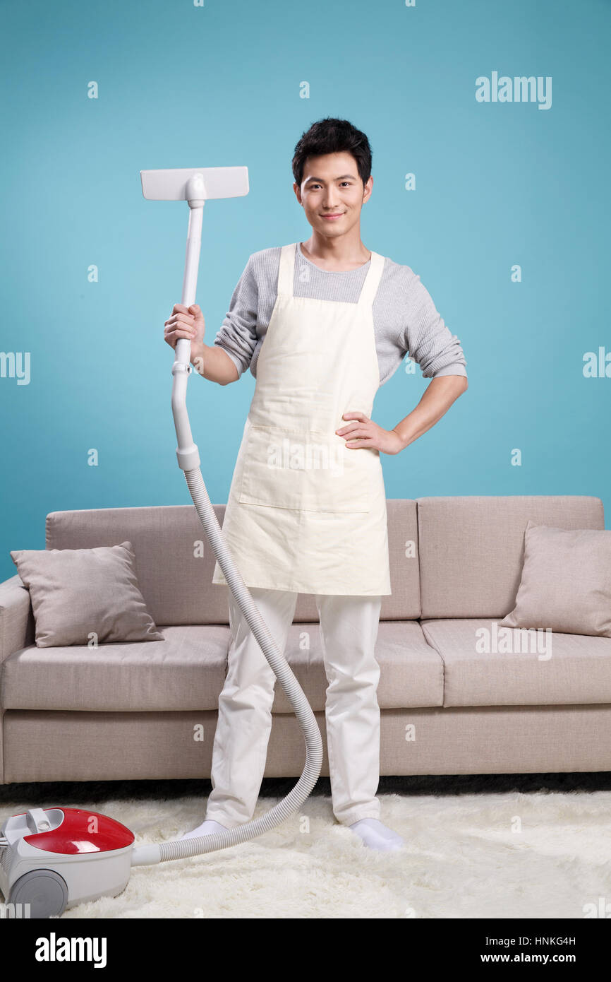Young men do housework Stock Photo - Alamy