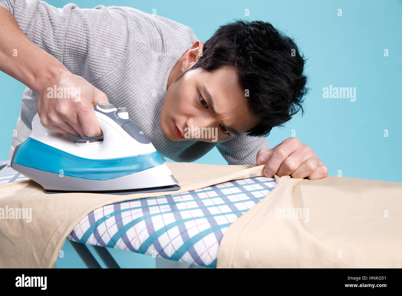 Young men do housework Stock Photo - Alamy
