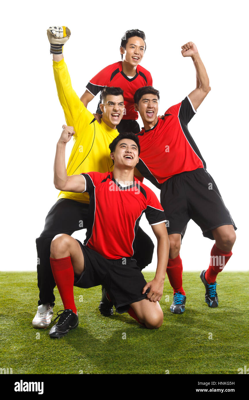 Football players celebrate success Stock Photo - Alamy