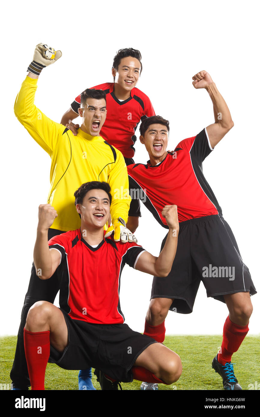 Football players celebrate success Stock Photo - Alamy