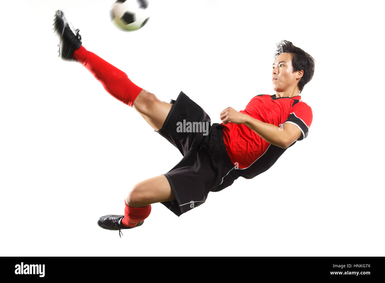 Football mid air action Cut Out Stock Images & Pictures - Alamy