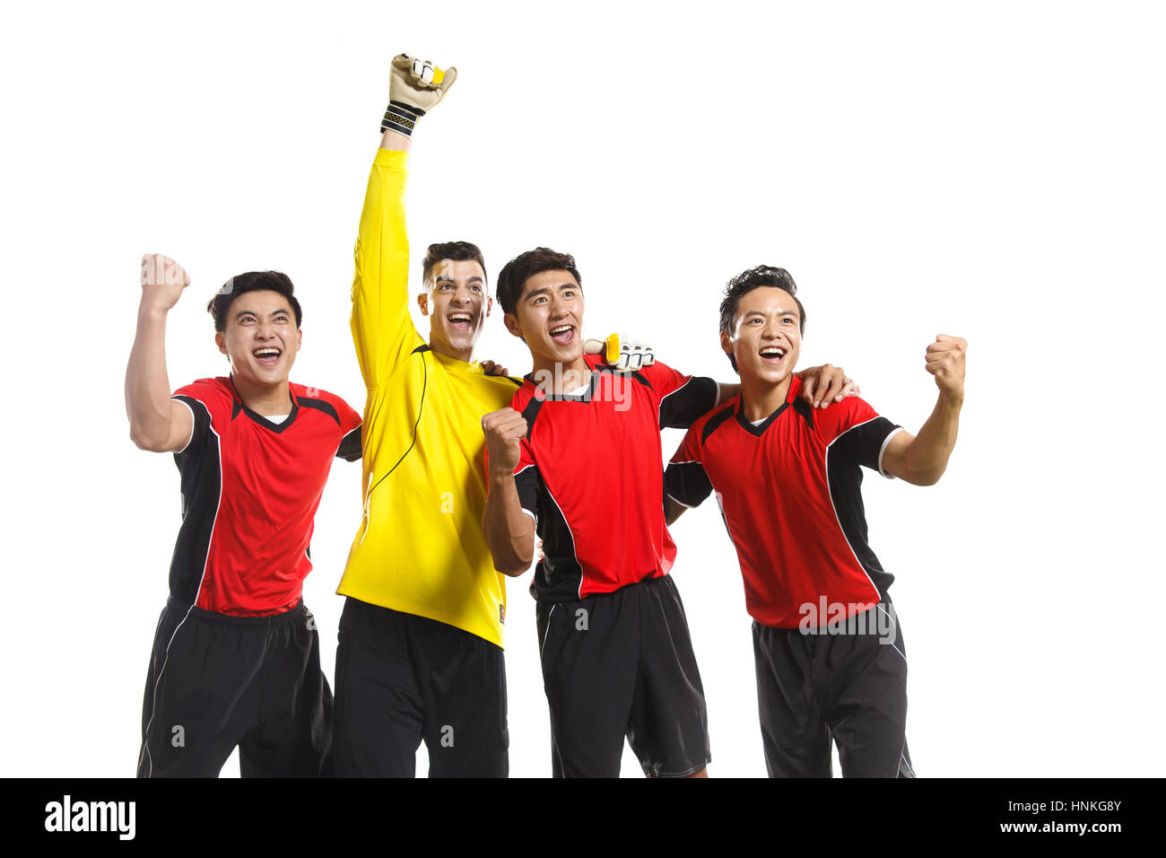 Football players celebrate success Stock Photo - Alamy