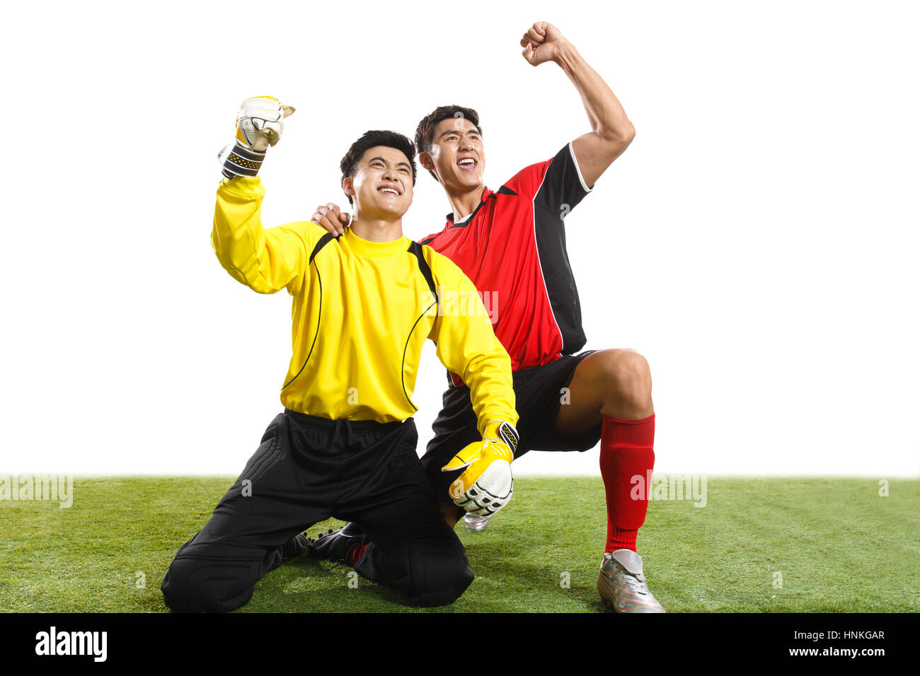 Football players celebrate success Stock Photo - Alamy