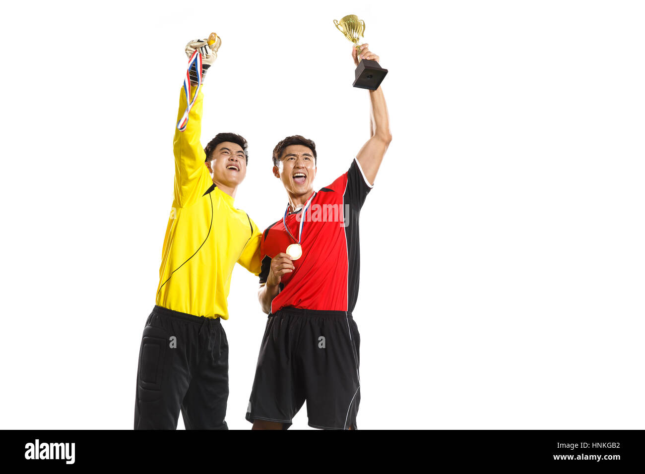 Football players celebrate success Stock Photo - Alamy