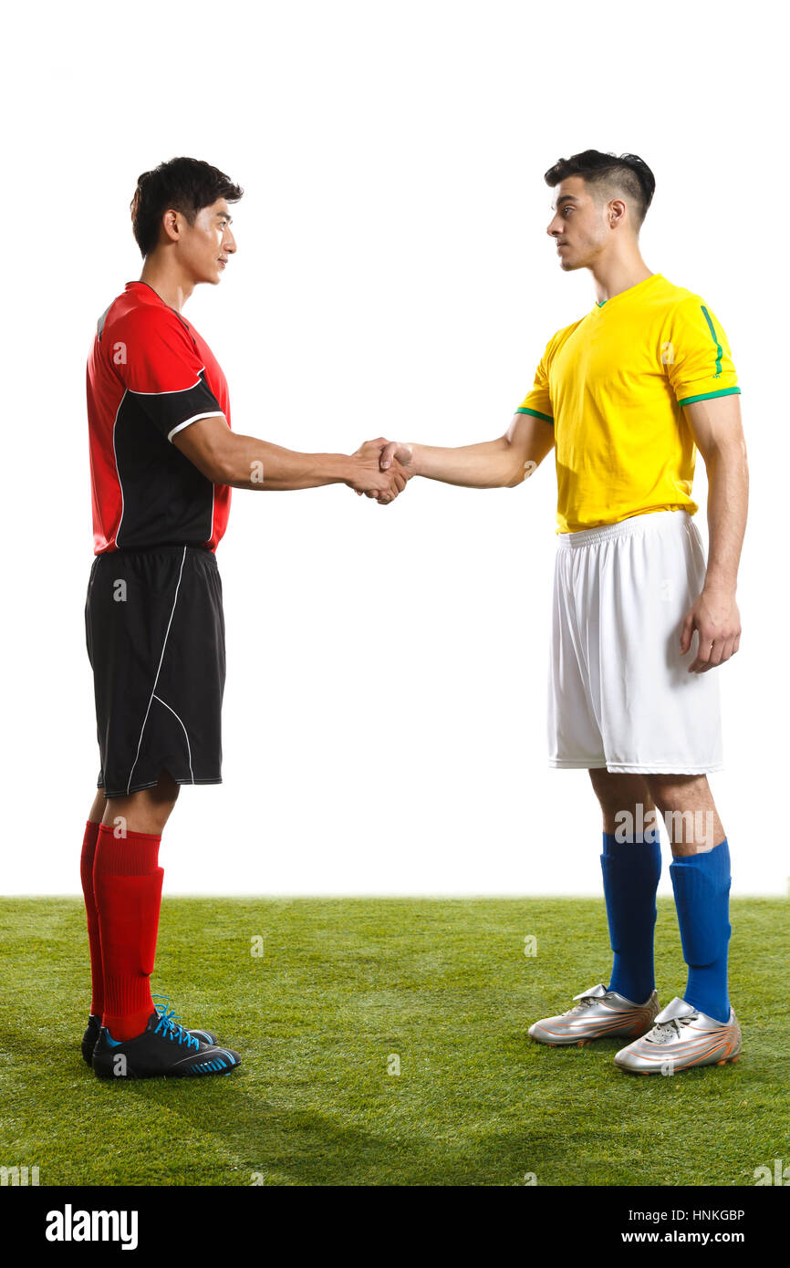 Football players shake hands Stock Photo - Alamy