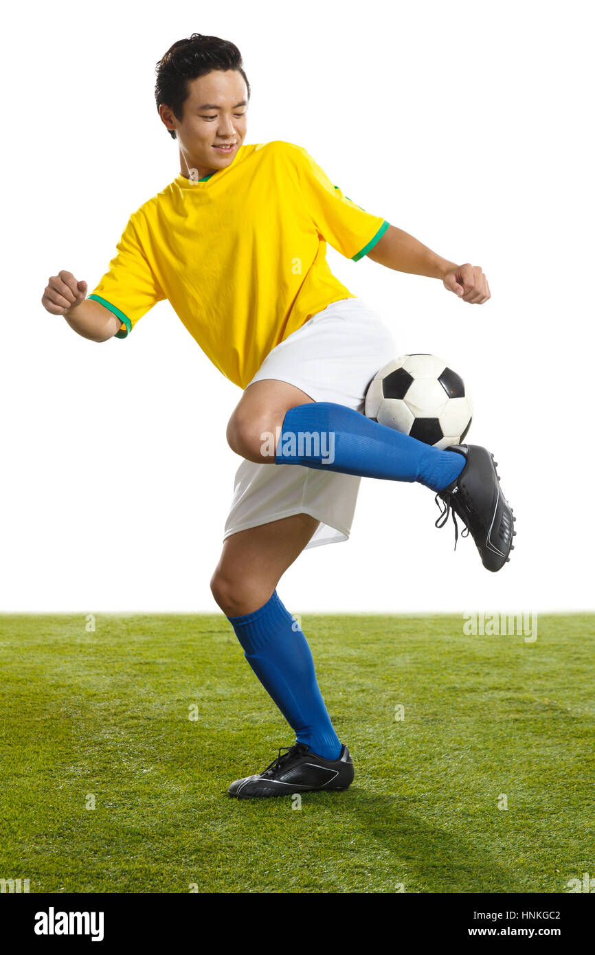 Football player is playing football Stock Photo - Alamy